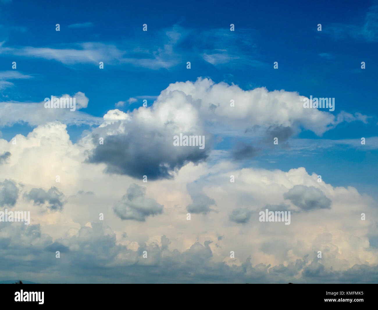 Blue sky and heap white cloud moving by wind and sun shine Stock Photo ...