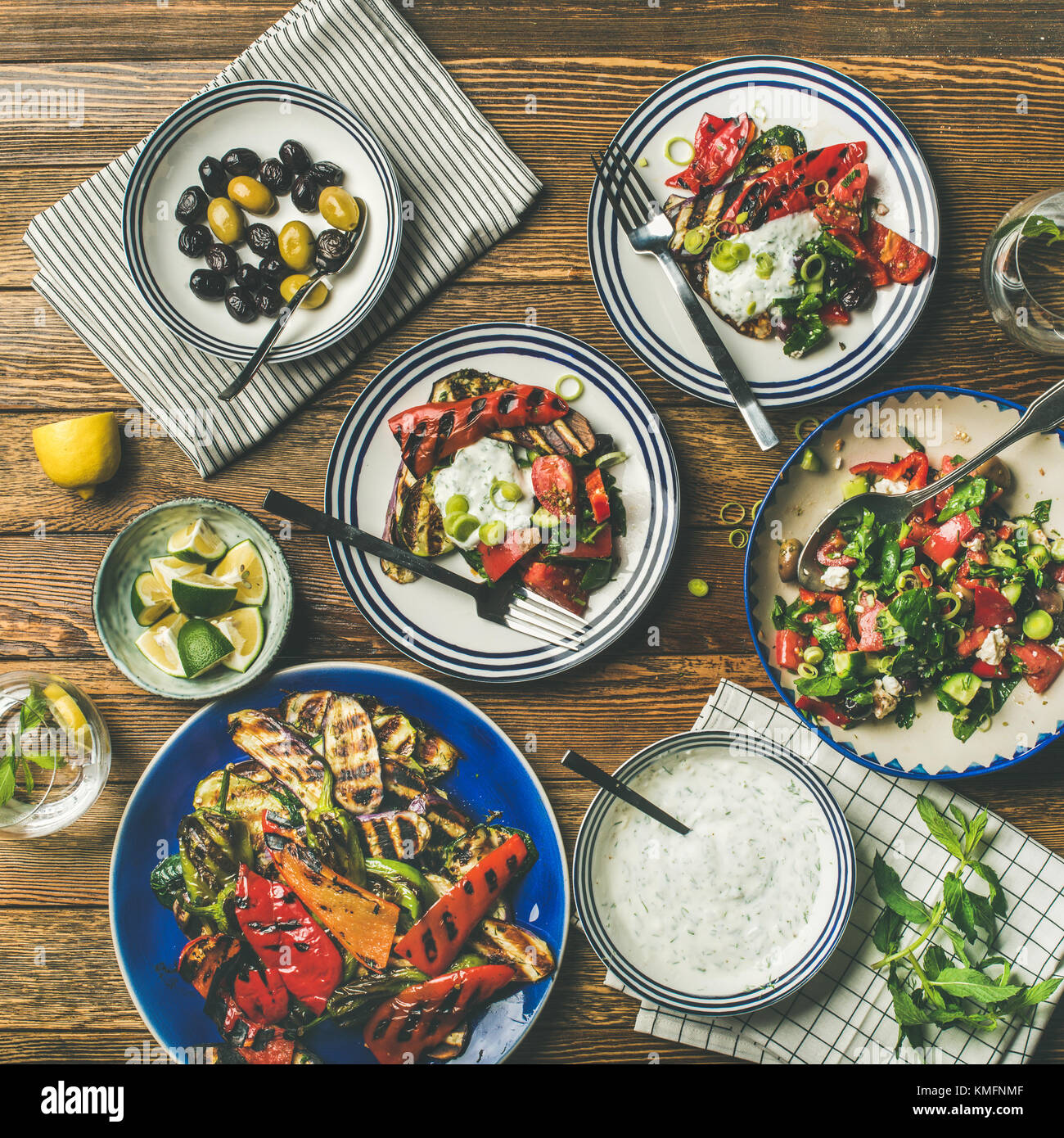 Flat-lay of healthy dinner table setting with snacks Stock Photo - Alamy
