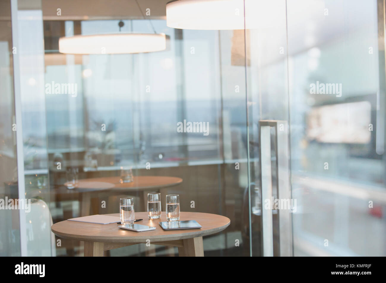 Water glasses and digital tablets on table in conference room Stock ...