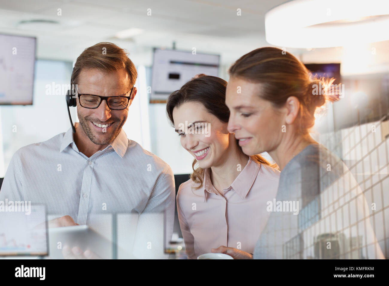Business people standing together tablet hi-res stock photography and ...