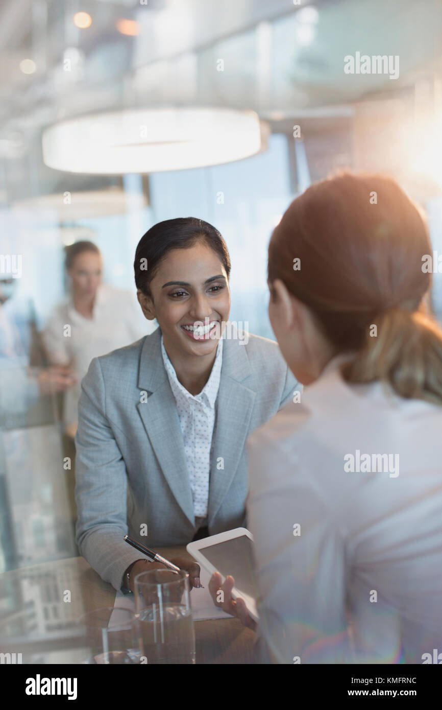 Young businesswomen using tablet hi-res stock photography and images ...