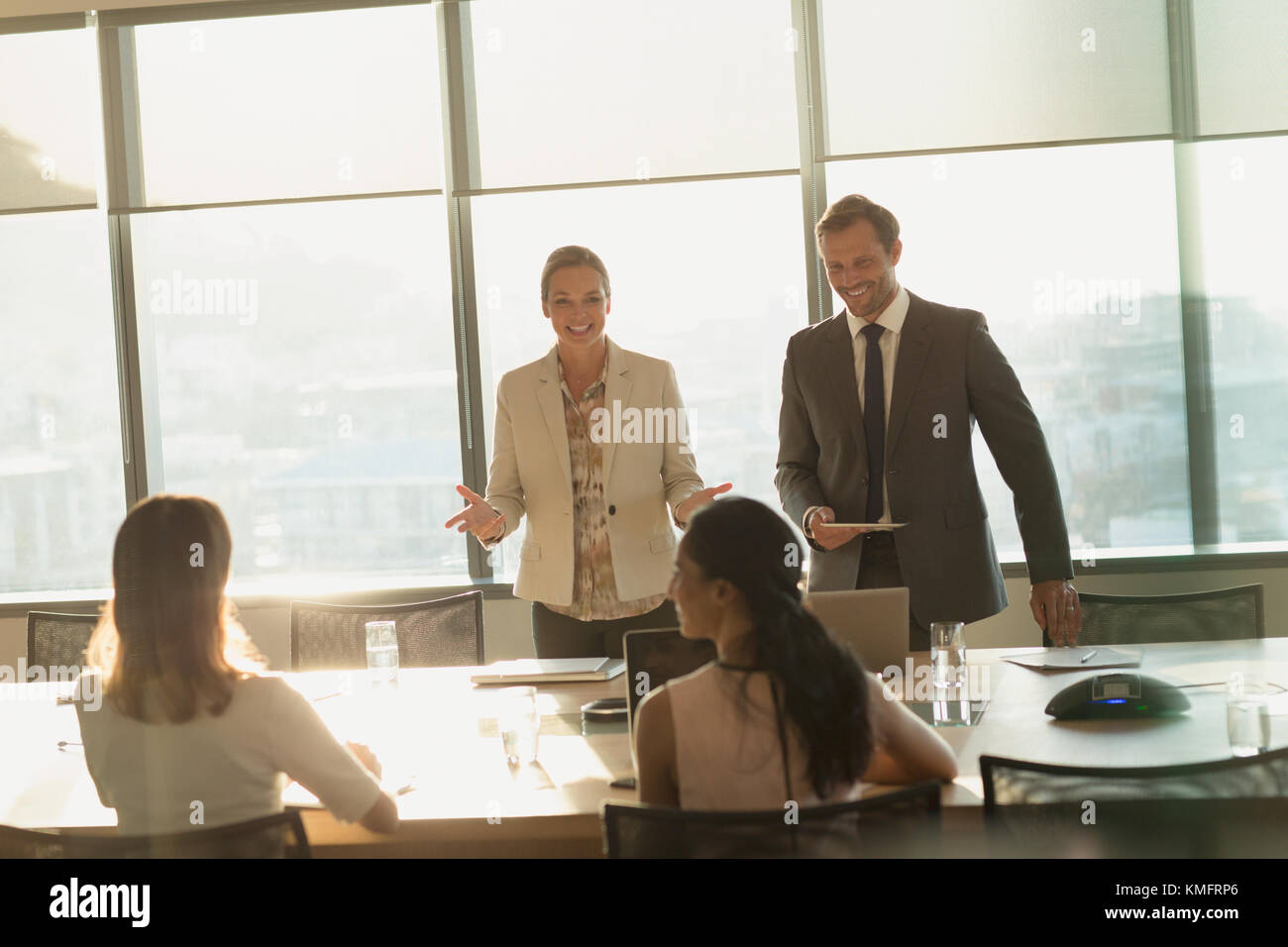 Happy business people talking hi-res stock photography and images - Alamy