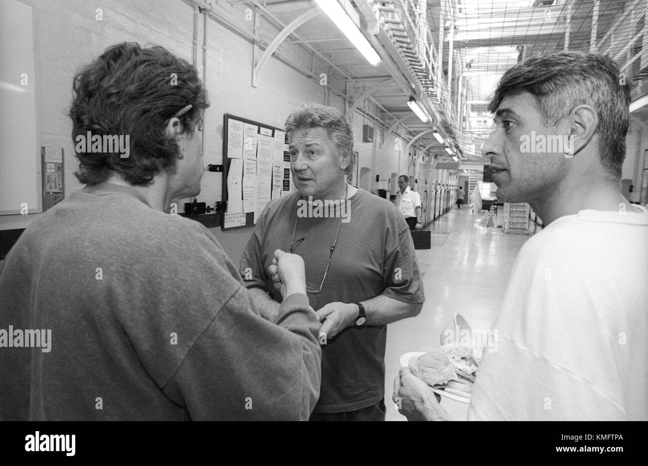 Inmates interacting on prison wing, HMP Winchester, Winchester ...