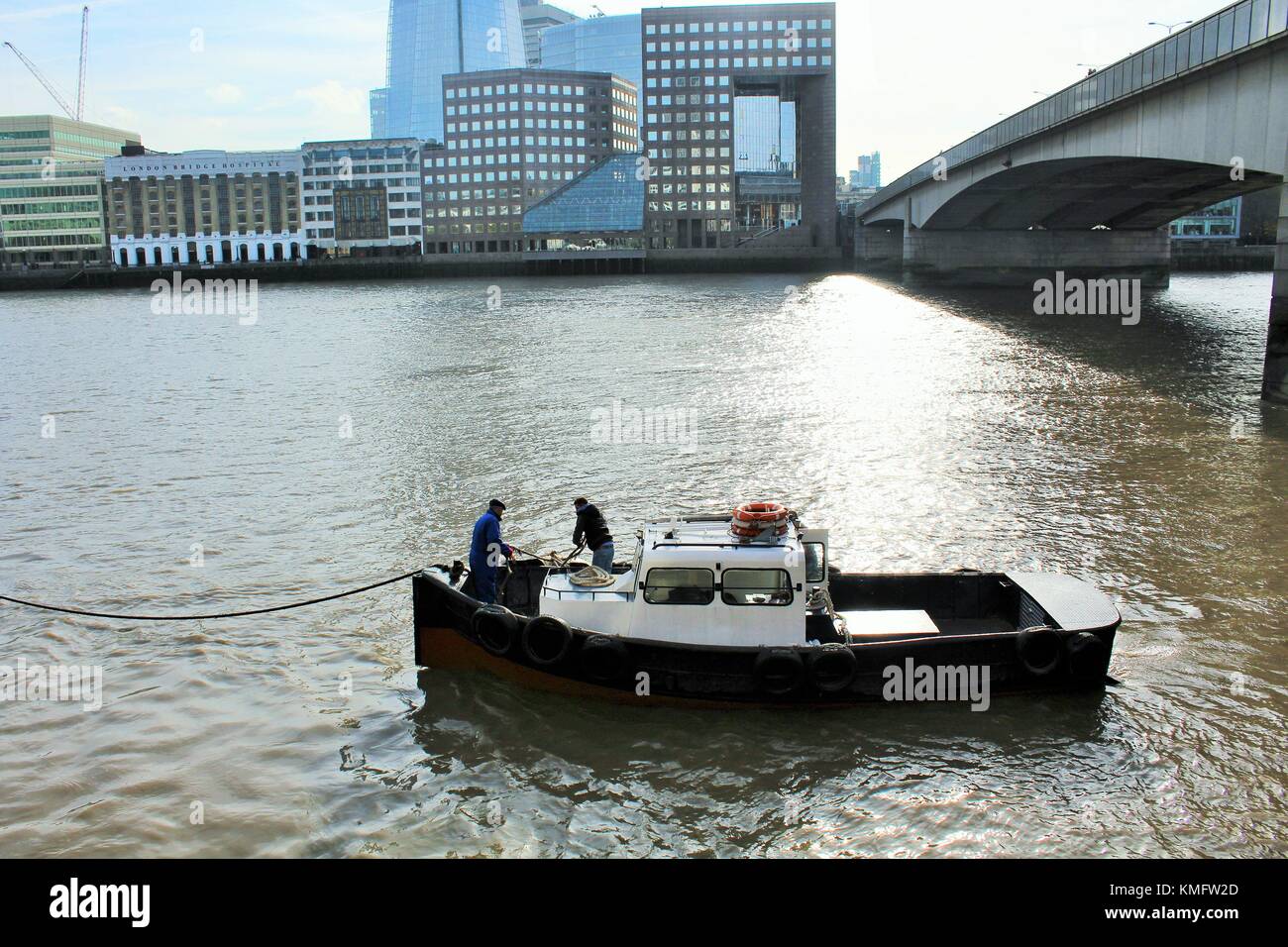 Fishing boat on the river thames in london england Stock Photo - Alamy