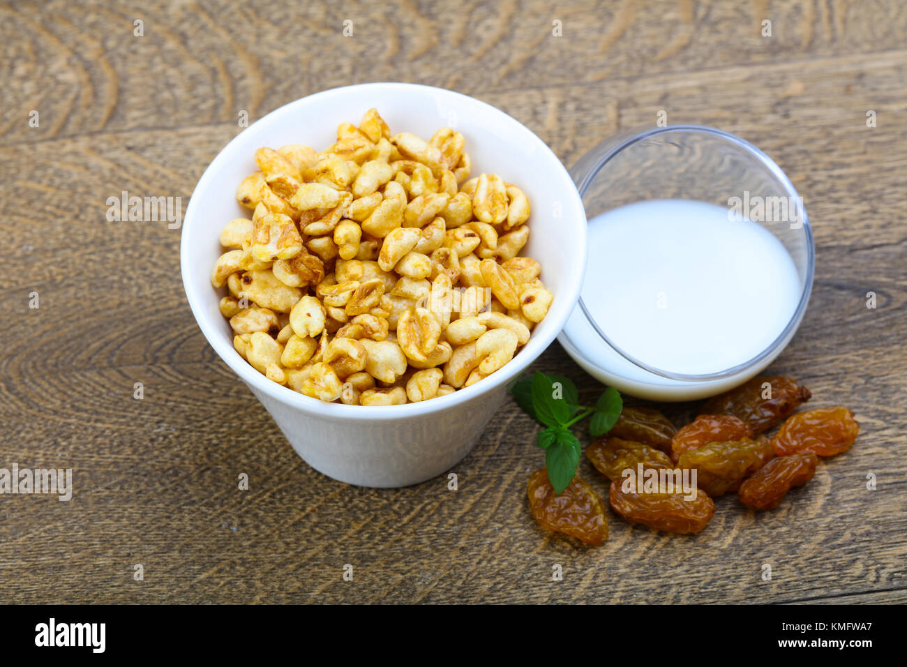 Rise flakes with milk, raisin and mint leaves Stock Photo - Alamy