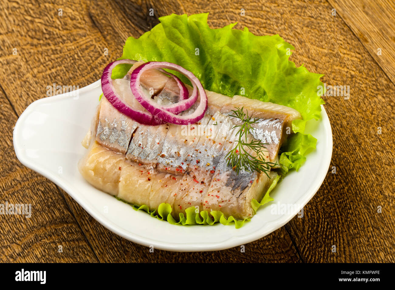 Sliced Herring fillet with dill and onion Stock Photo - Alamy