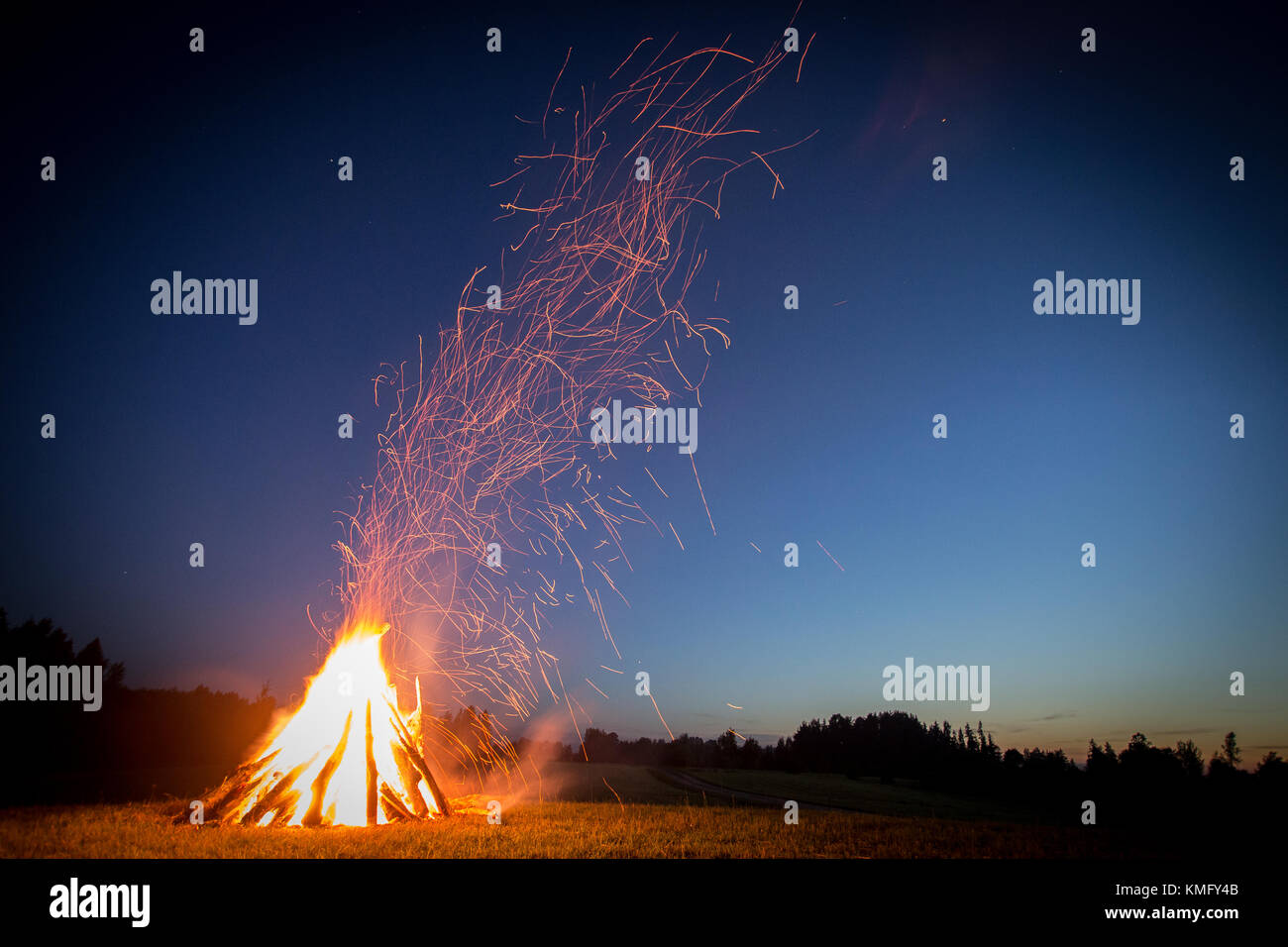 Bonfire at night with sparks Stock Photo - Alamy