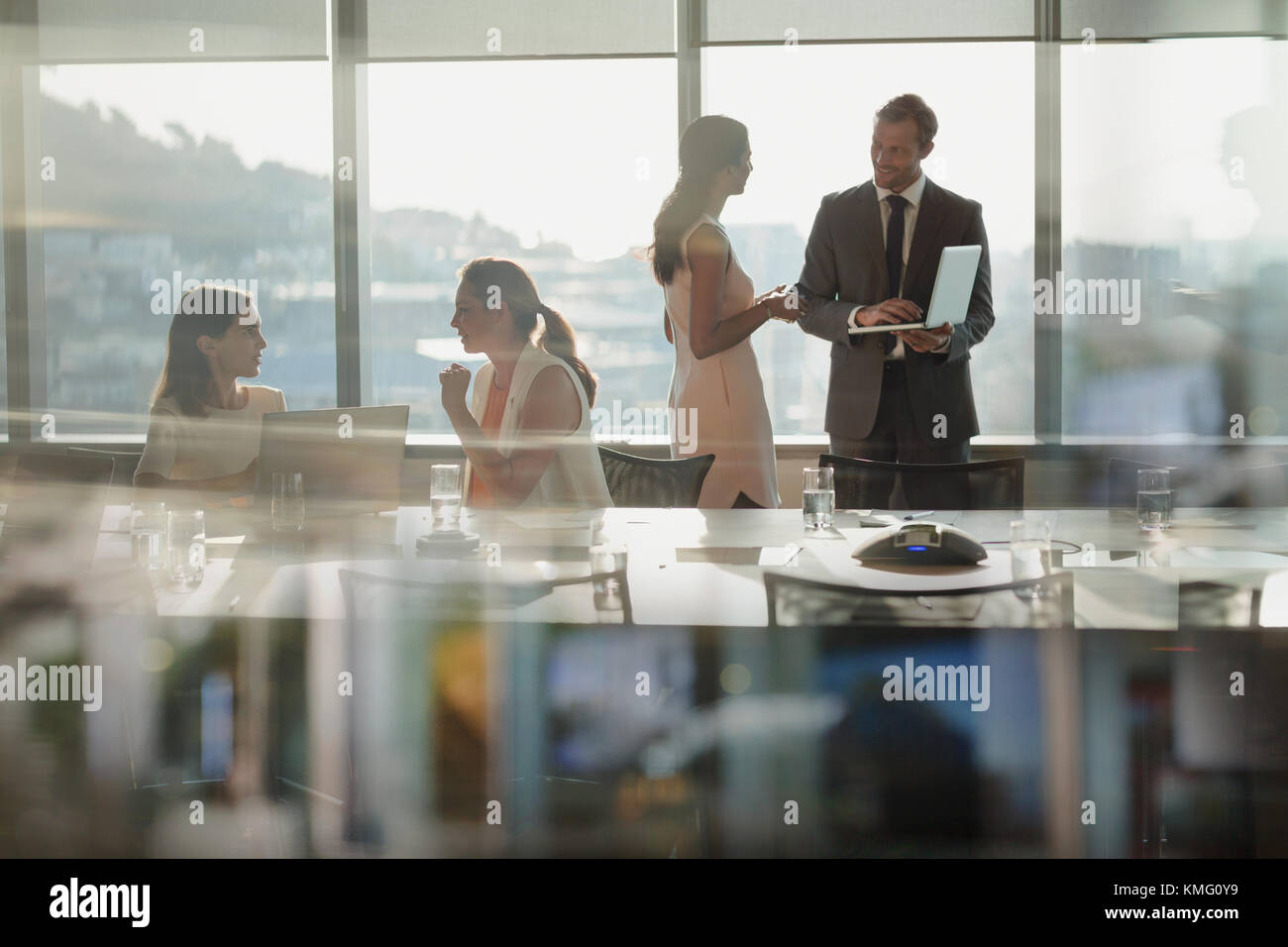 Business people talking, using laptop in conference room meeting Stock ...