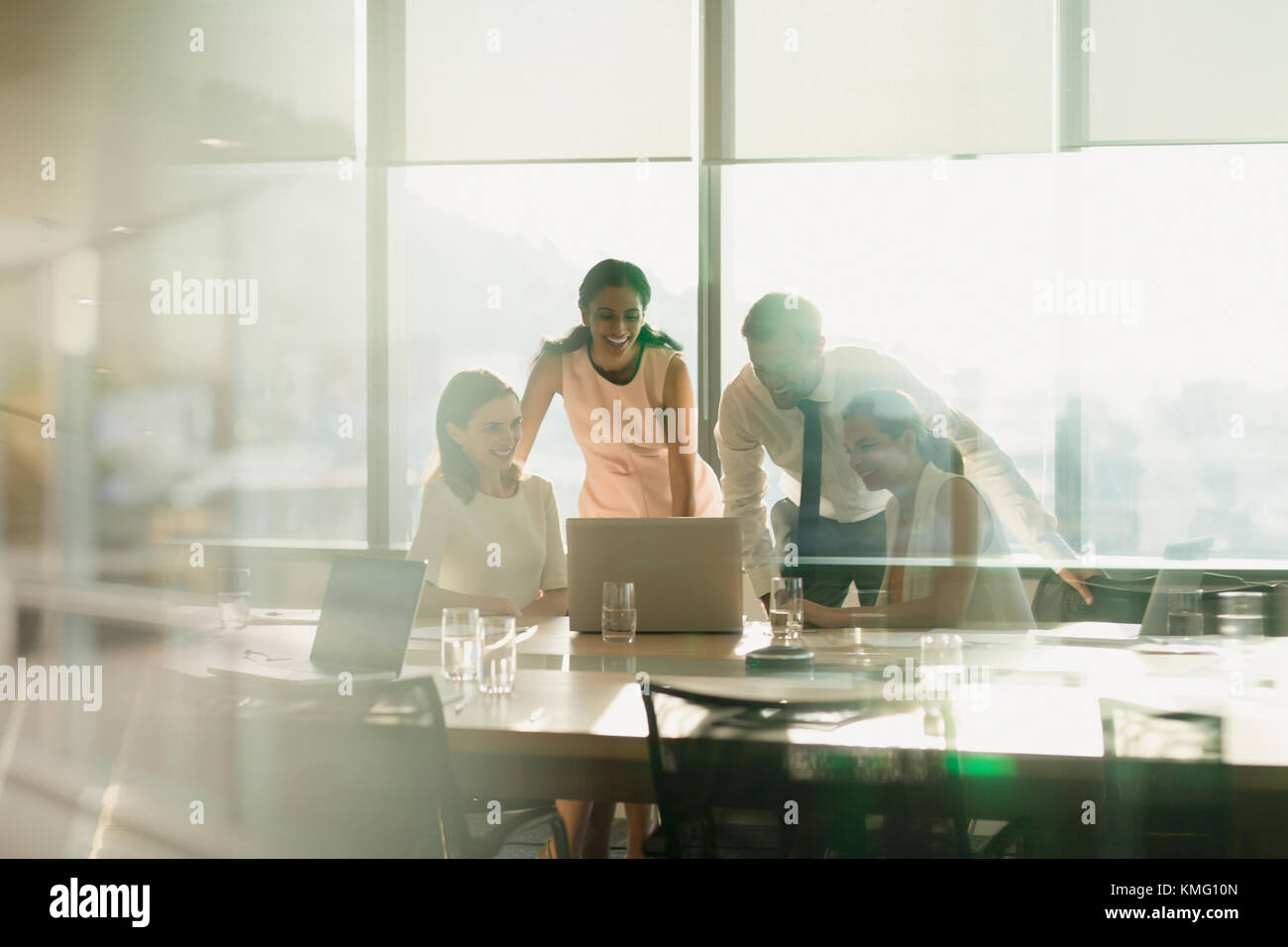 Business people working at laptop in conference room meeting Stock ...
