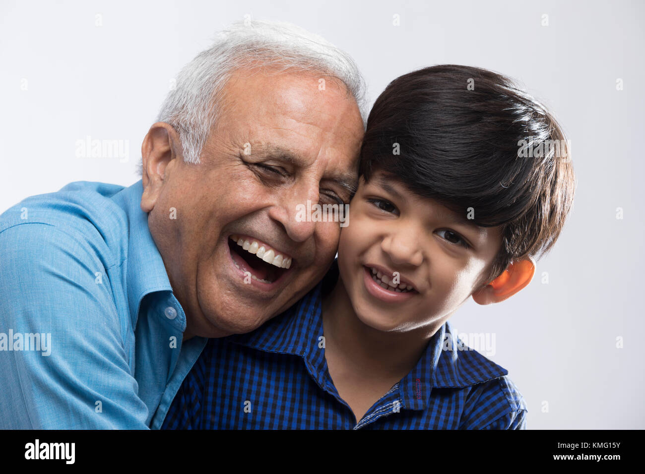 Portrait of grandfather and grandson smiling Stock Photo - Alamy