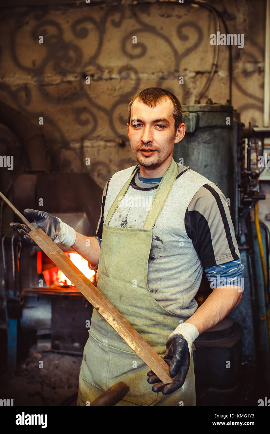 Blacksmith working metal stove hi-res stock photography and images - Alamy