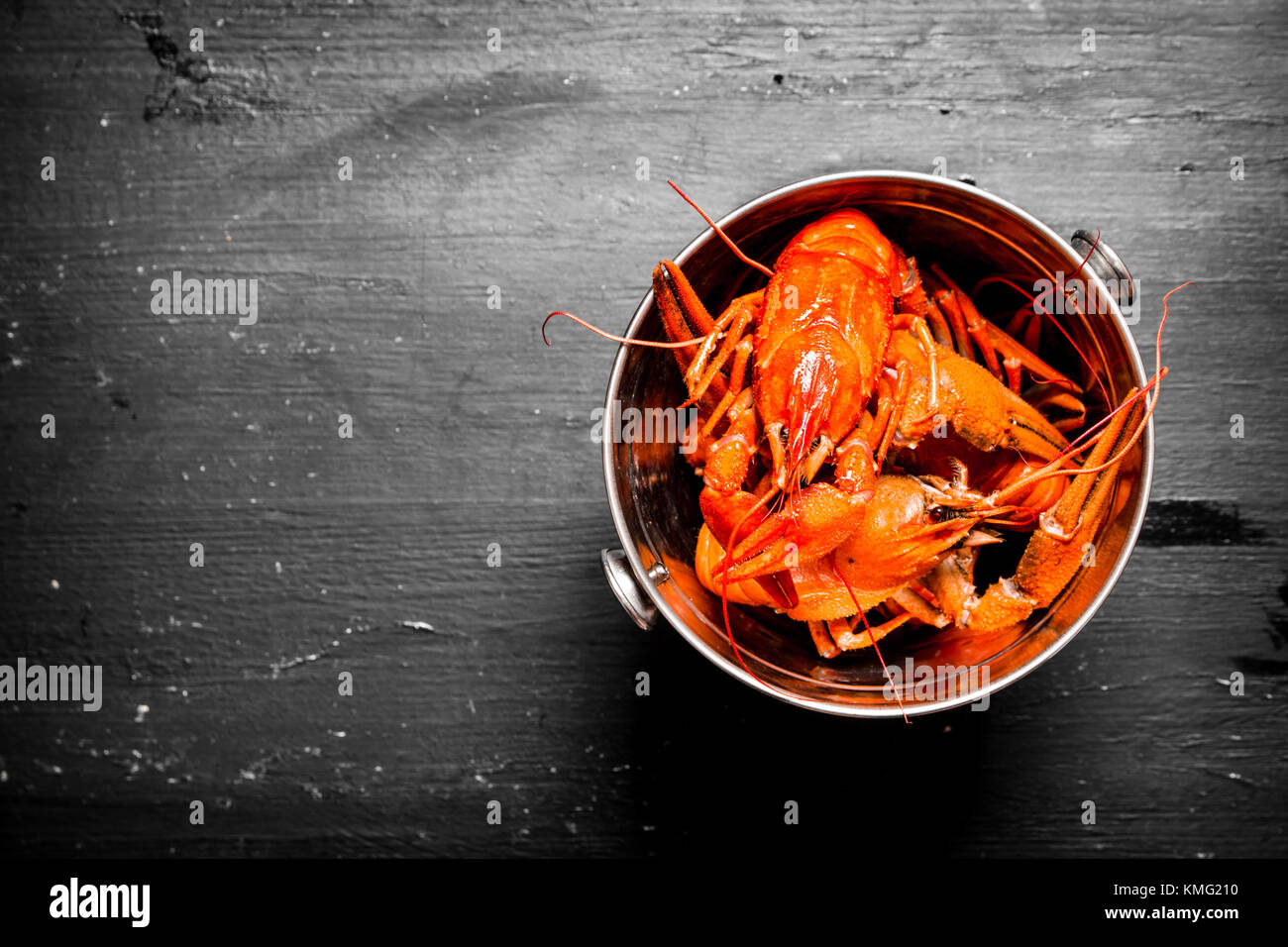 Boiled crawfish in a metal bucket. On a black chalkboard Stock Photo ...