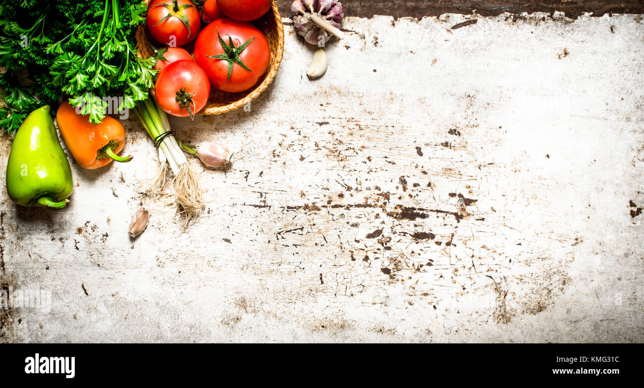 Organic vegetables. Natural vegetables and herbs. On rustic background ...