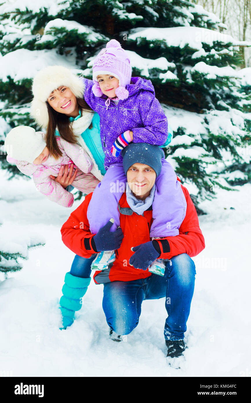 happy family with two kids outdoor in the winter park Stock Photo - Alamy