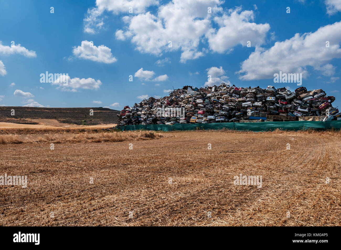 Used abandoned cars stacked for recycling in a scrap metal facility in ...