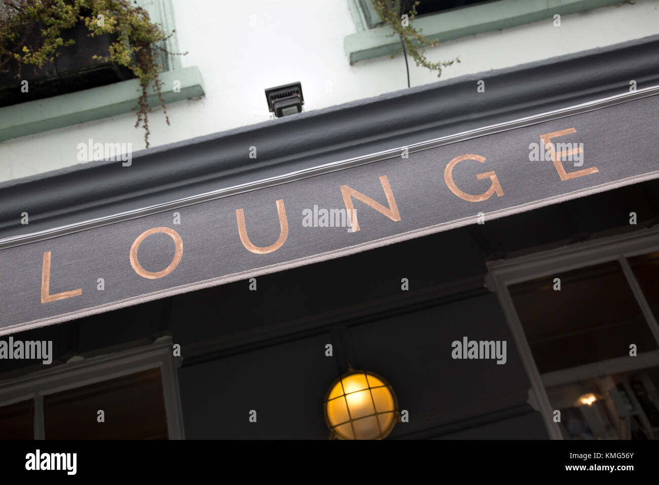Lounge Sign on Building Facade Stock Photo - Alamy