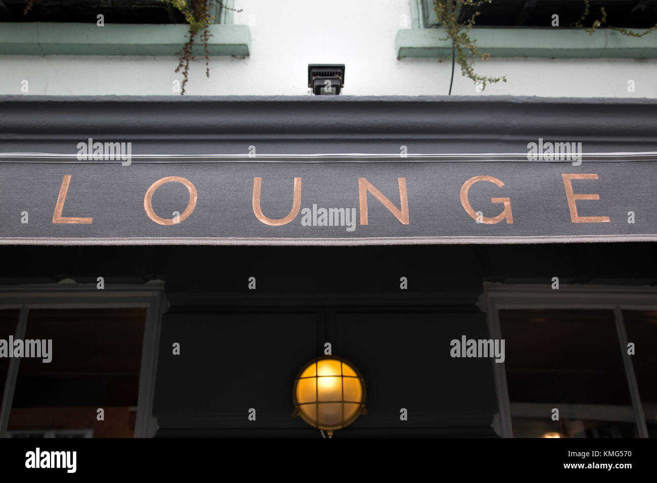 Lounge Sign on Building Facade Stock Photo - Alamy