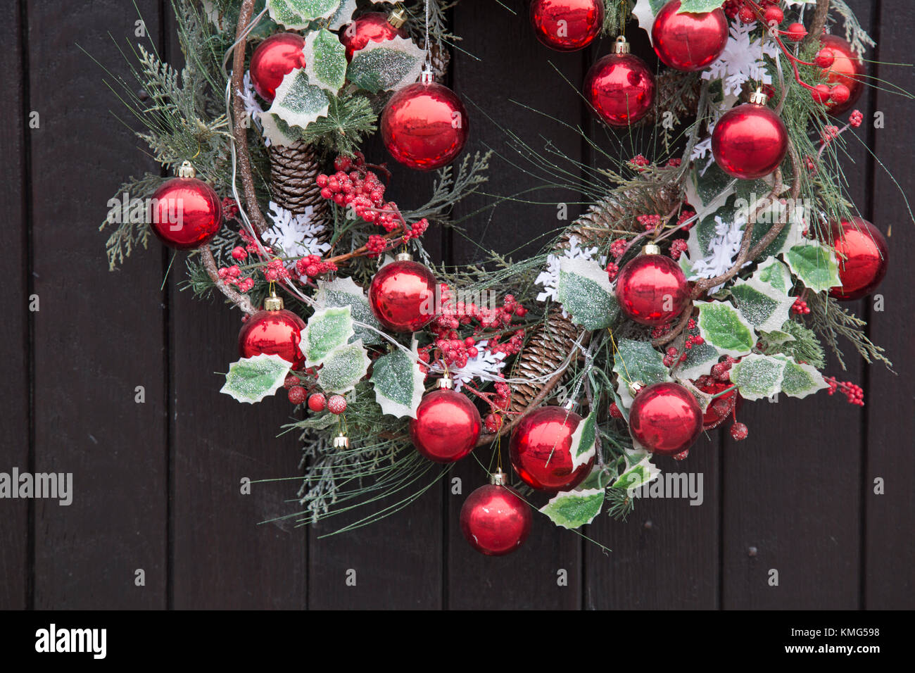 Red Ball Christmas Decoration on Front Door Stock Photo - Alamy