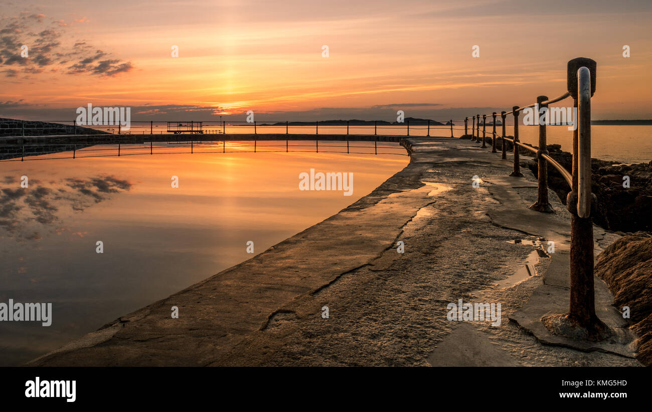 sunrise reflected on the swimming pool Stock Photo - Alamy