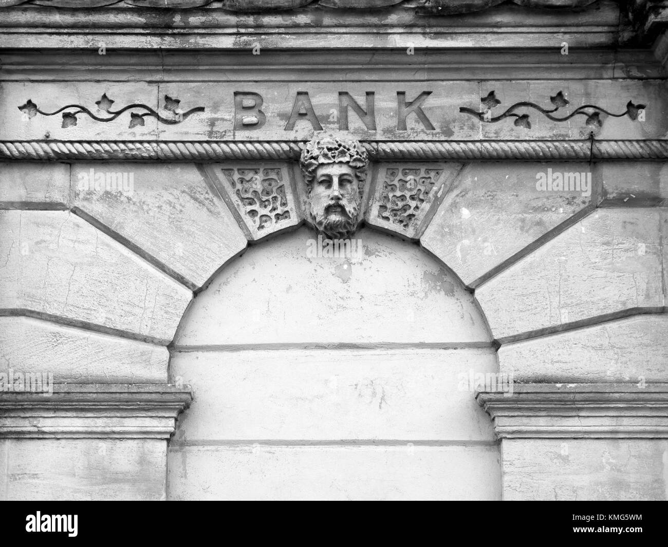 Bank sign carving on stone wall above local branch Stock Photo - Alamy