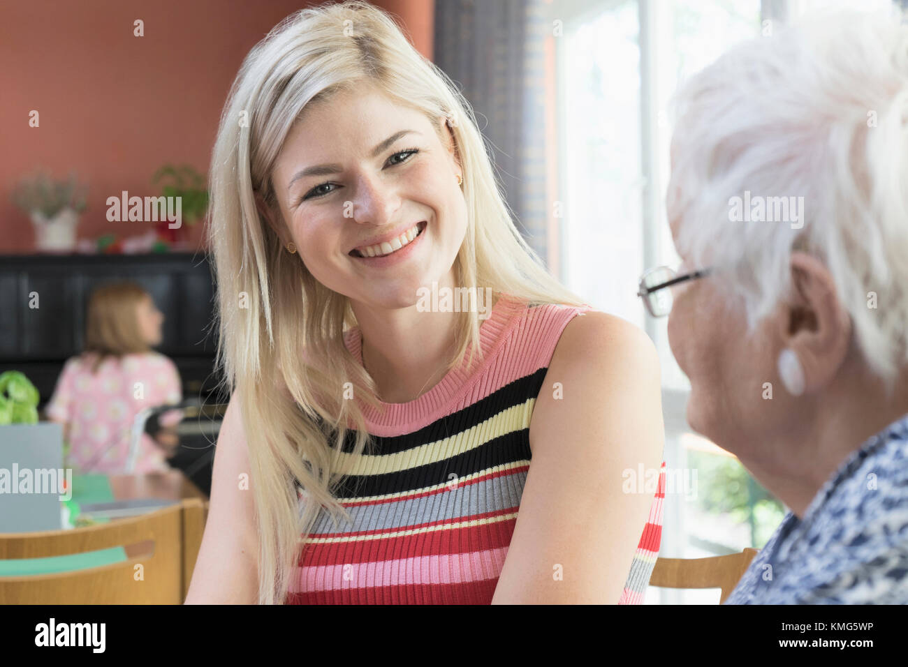 Woman visits her mother's room Stock Photo - Alamy