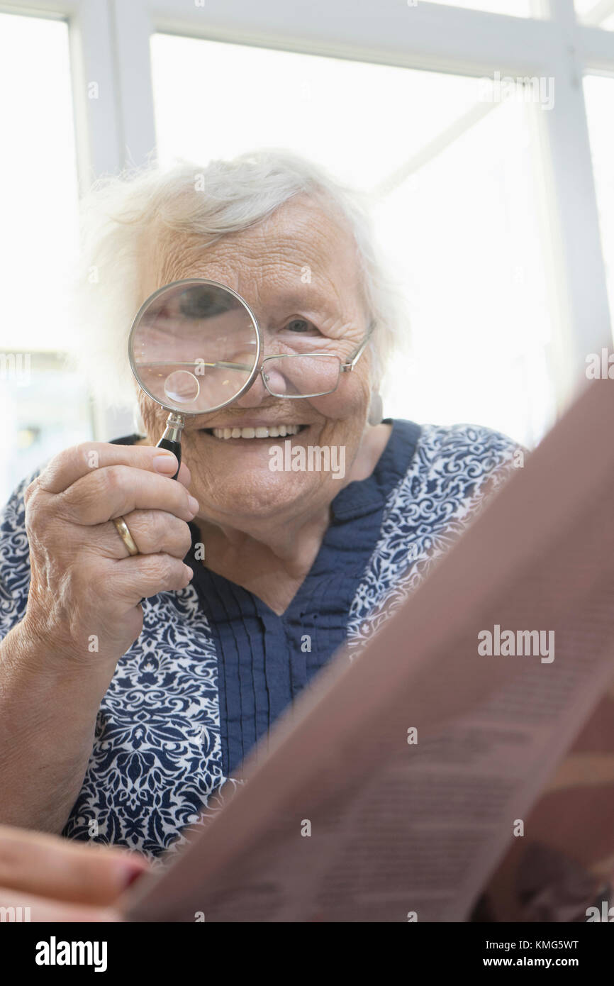 Magnifying glass reading adult hi-res stock photography and images - Alamy
