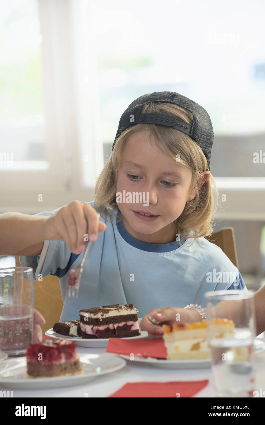 Boy Eating Cake at home Stock Photo - Alamy