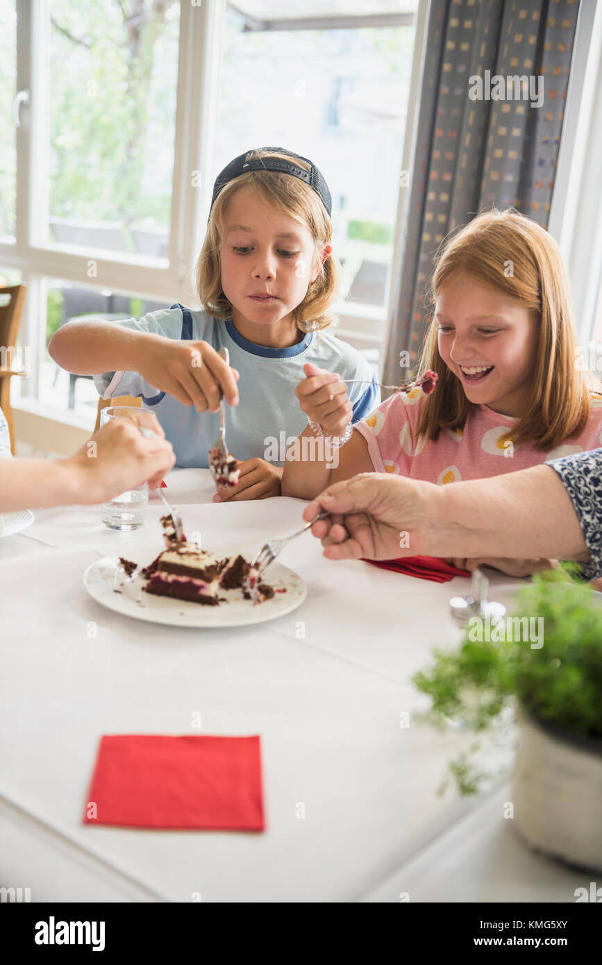 Family eating cake at rest home Stock Photo - Alamy