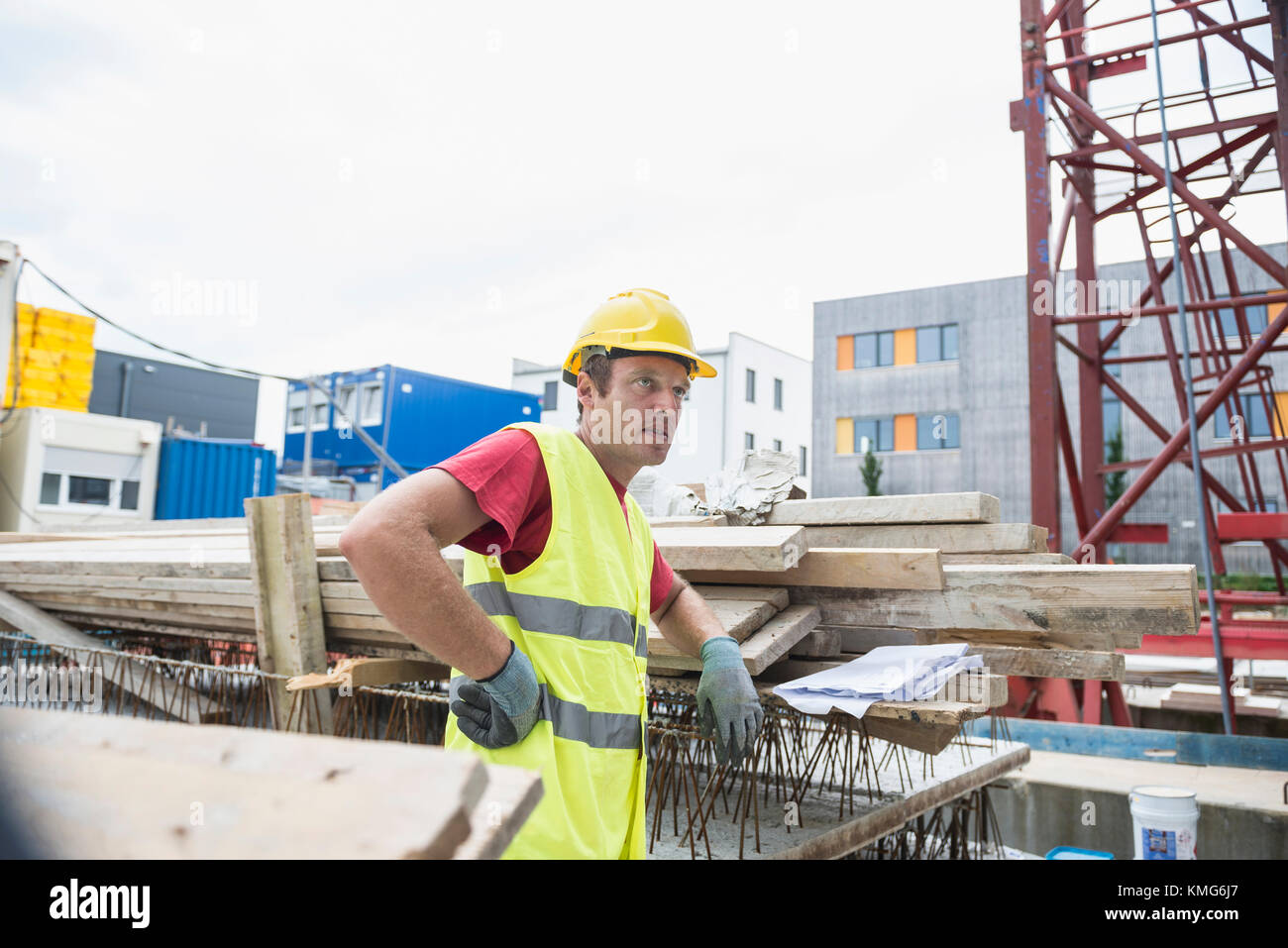 Thoughtful construction worker taking a break at building site Stock ...