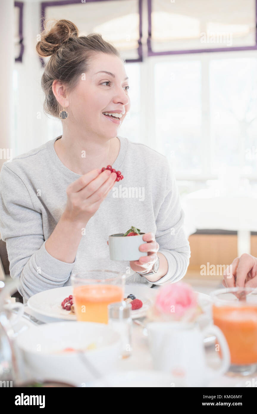 Woman sitting breakfast table hi-res stock photography and images - Alamy