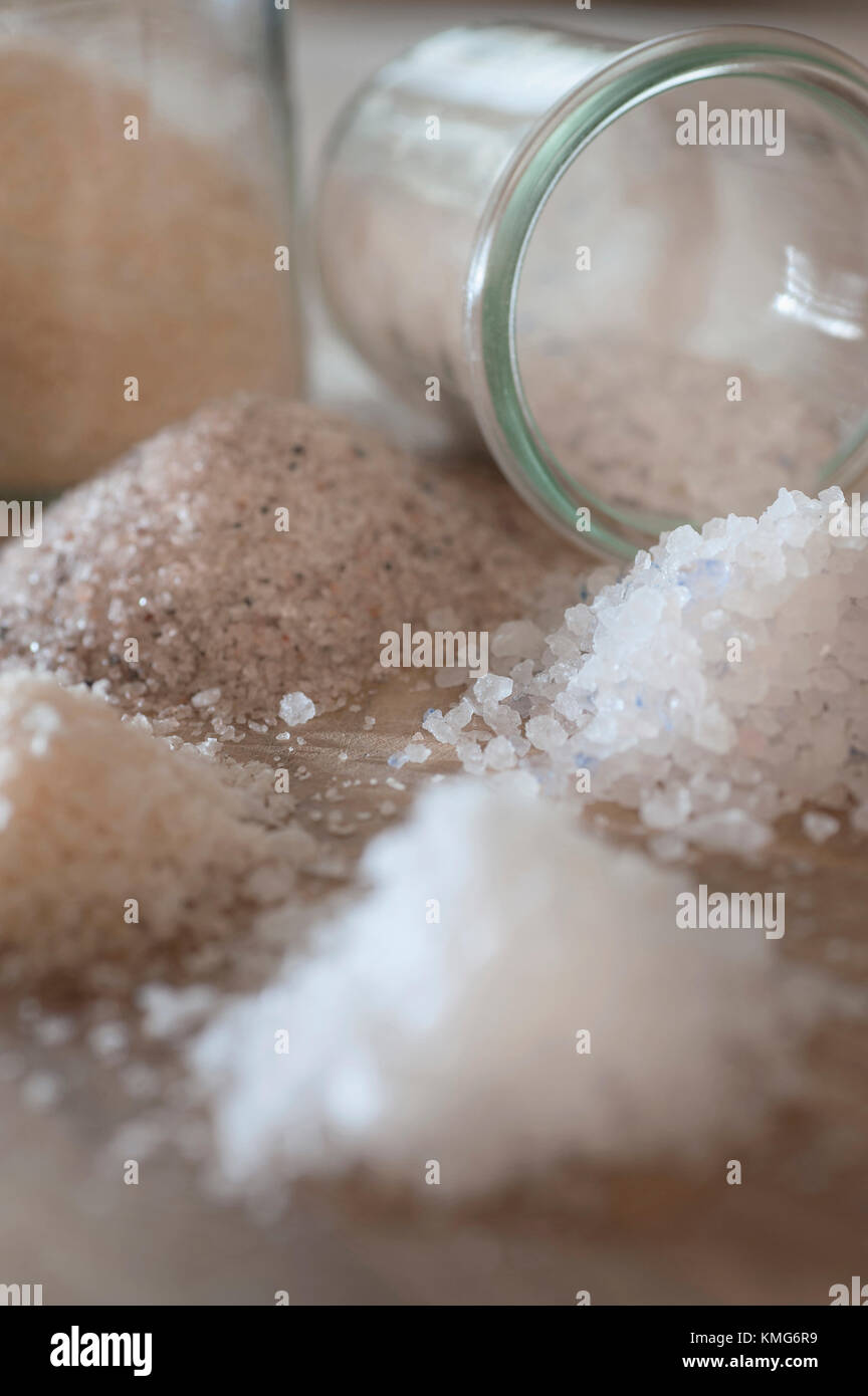 Fallen glass with variety of salt Stock Photo - Alamy