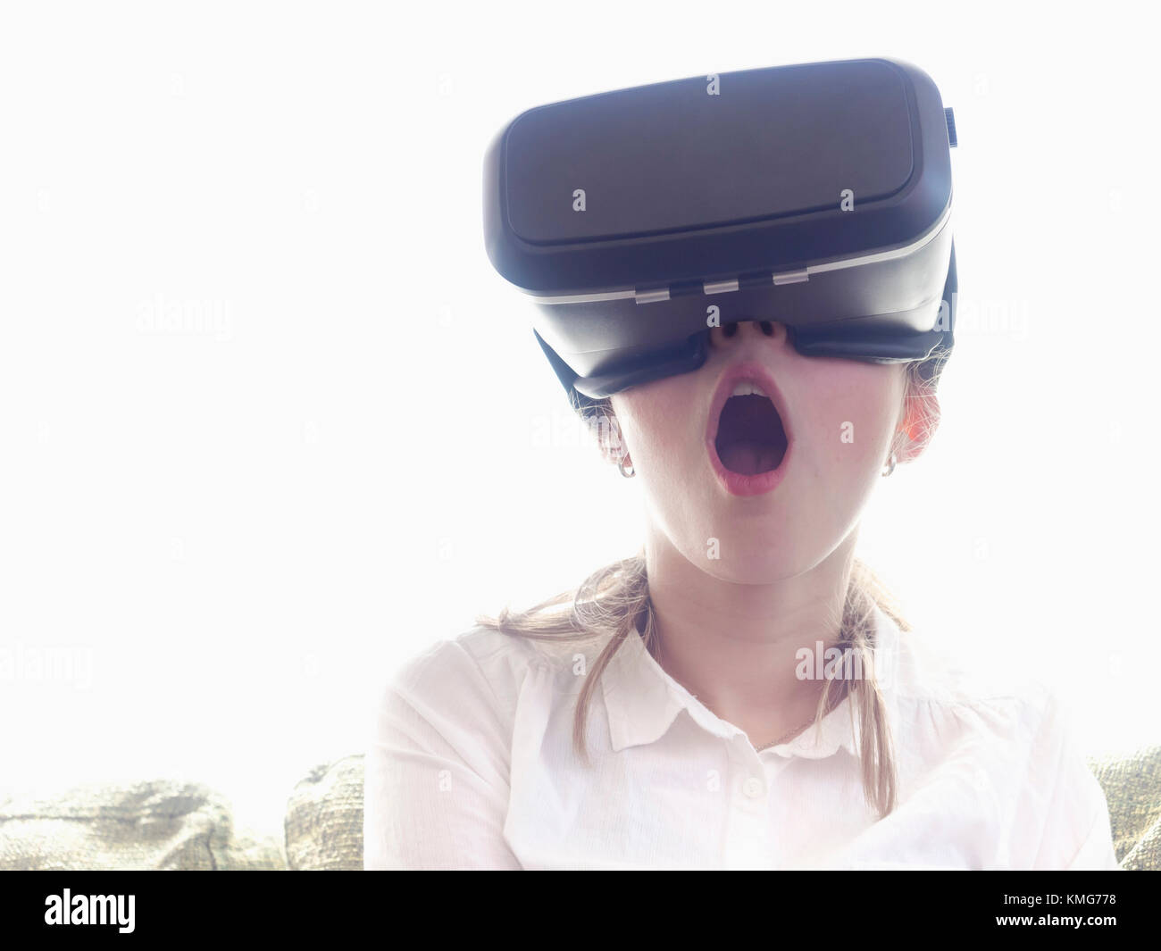 Girl using vr headset sitting hi-res stock photography and images - Alamy