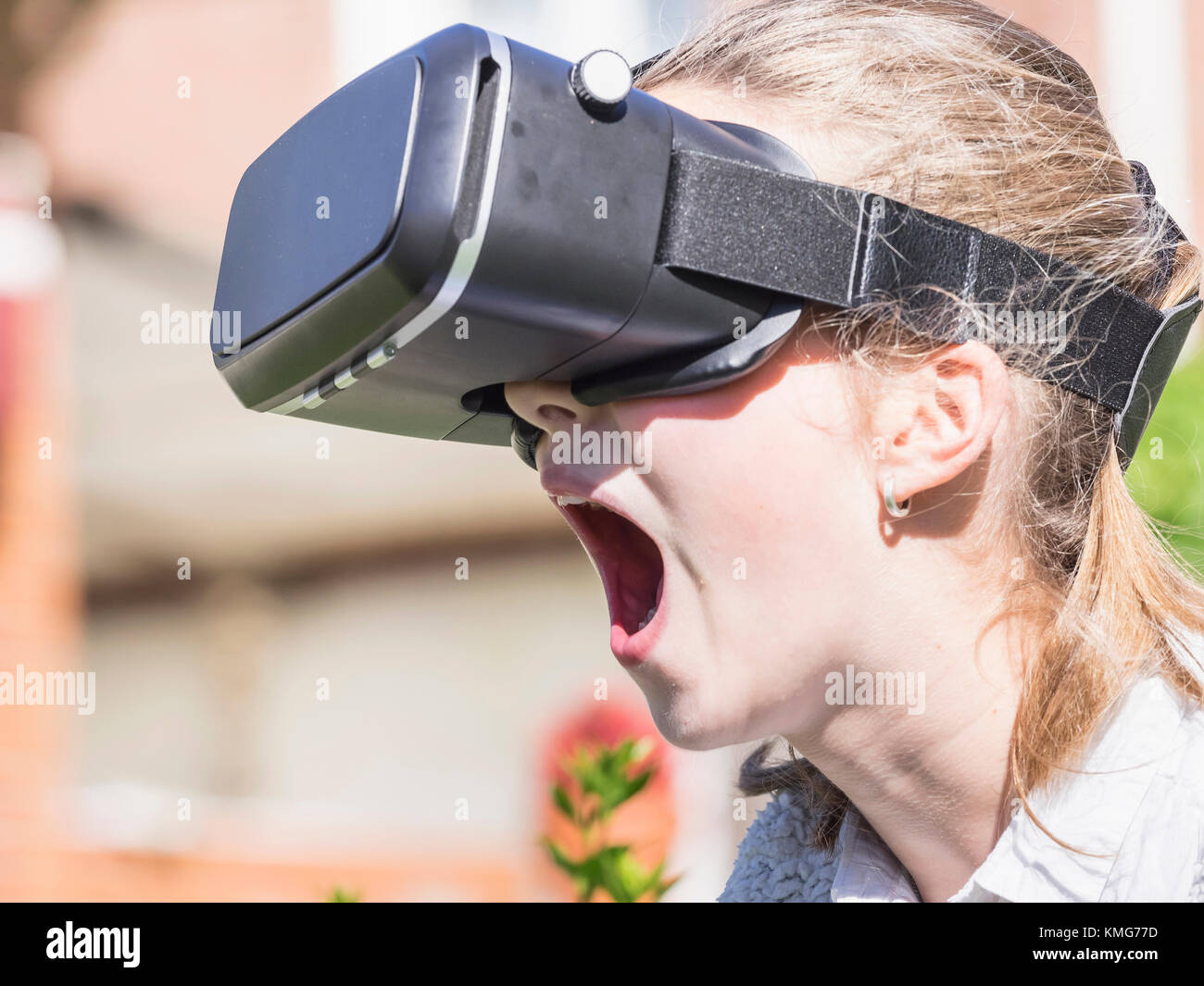 Girl scared during virtual reality exploration Stock Photo - Alamy