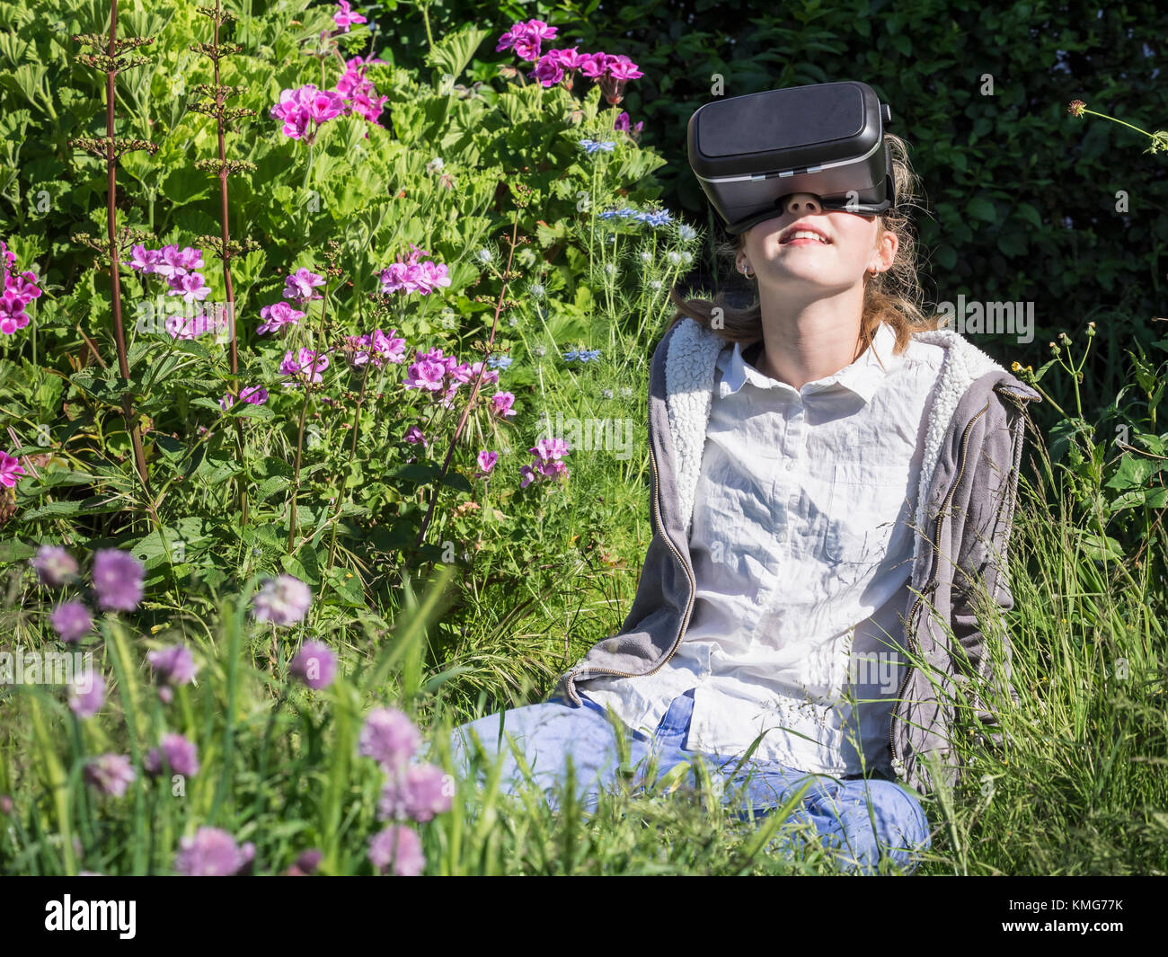 Girl using virtual reality headset at garden Stock Photo - Alamy