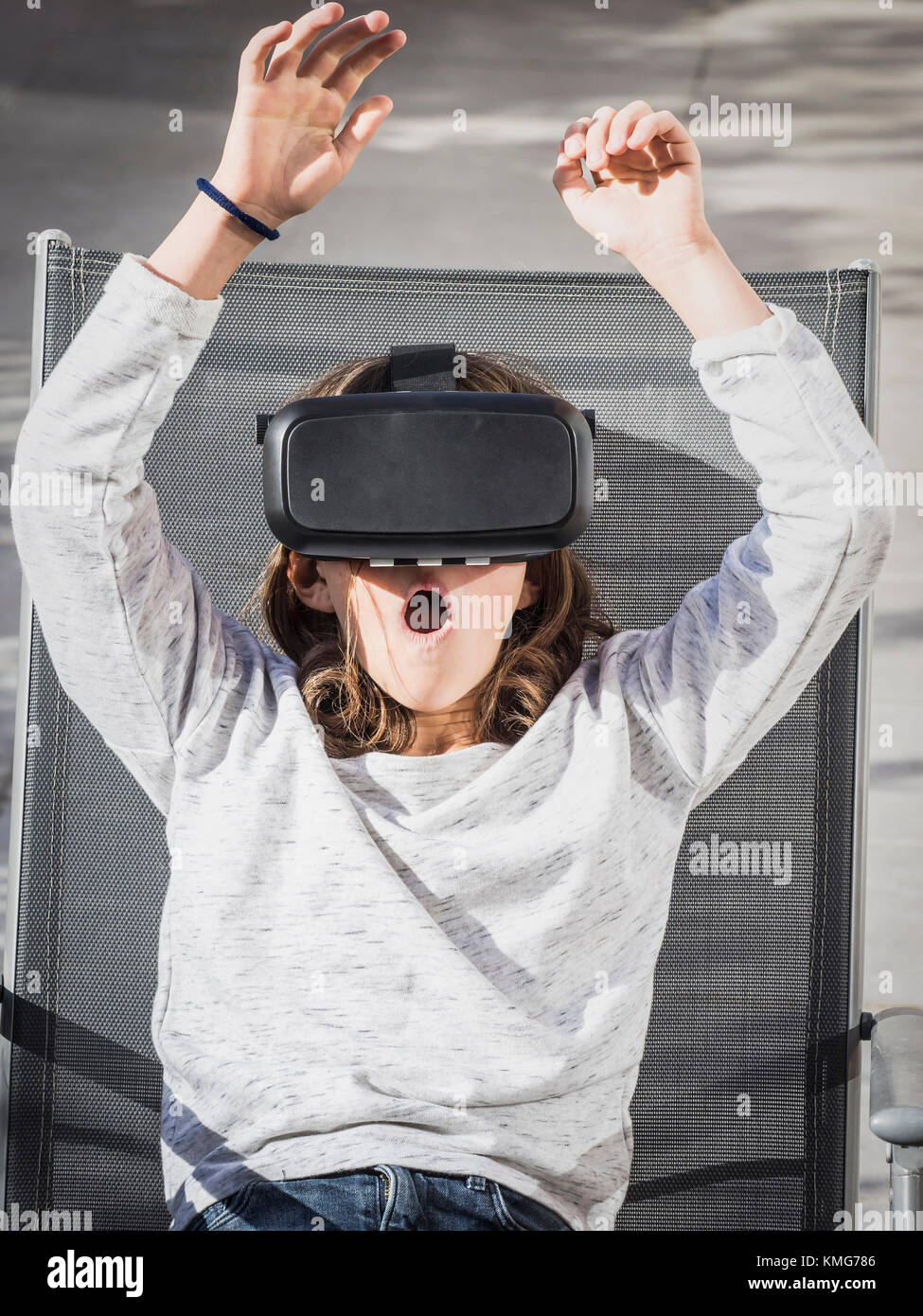 Girl wearing virtual reality glasses Stock Photo - Alamy