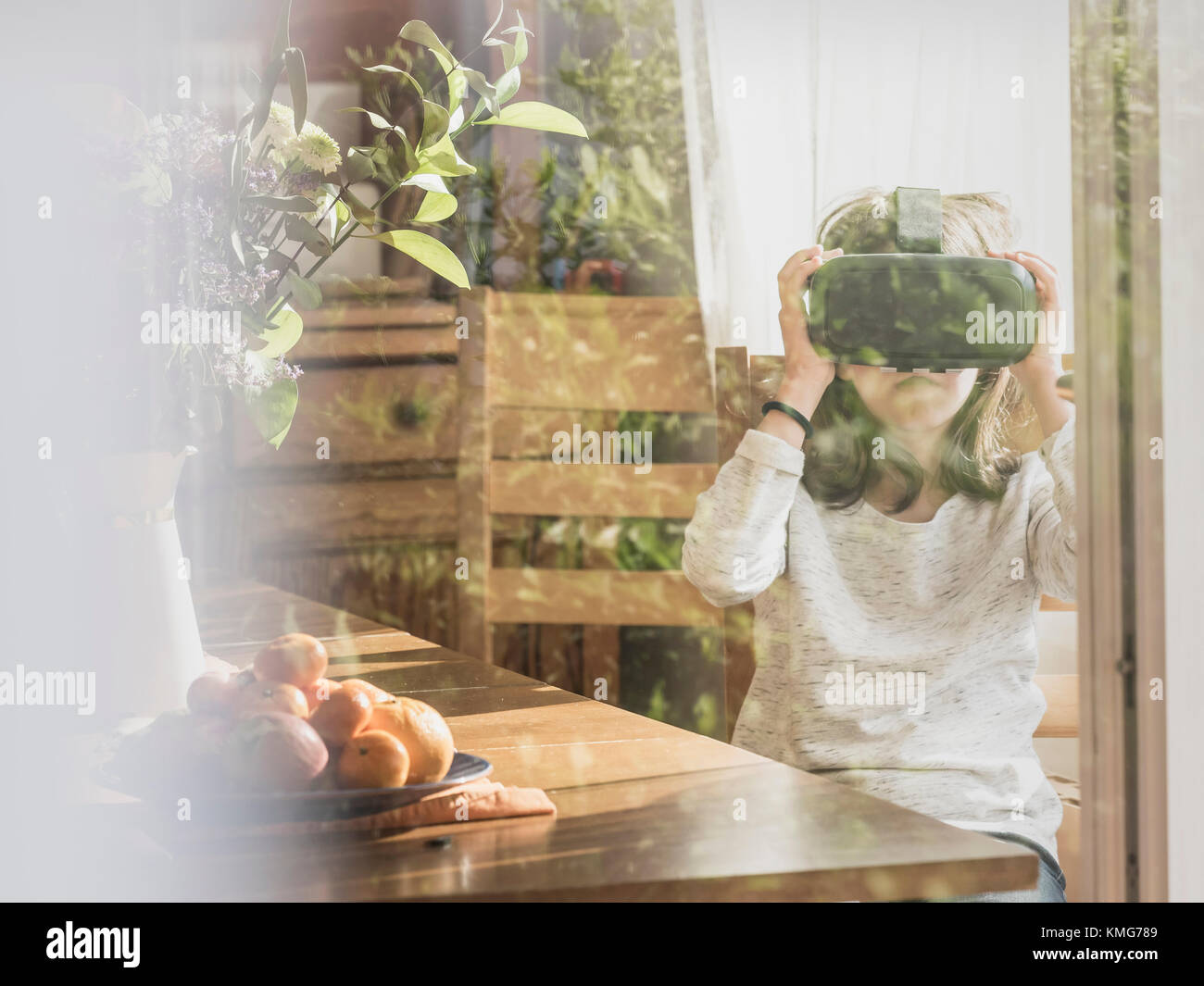 Girl wearing virtual reality glasses Stock Photo - Alamy