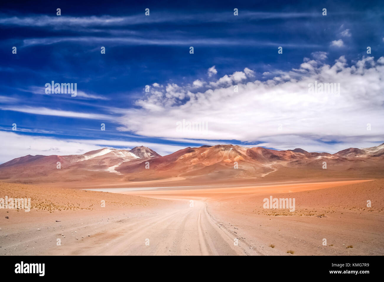 Sandy and gravel desert road through remote part of southern Altiplano ...