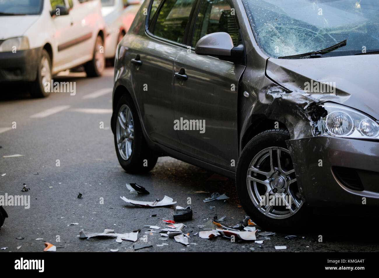 Damaged car after crash with motorcycle on an urban street Stock Photo ...