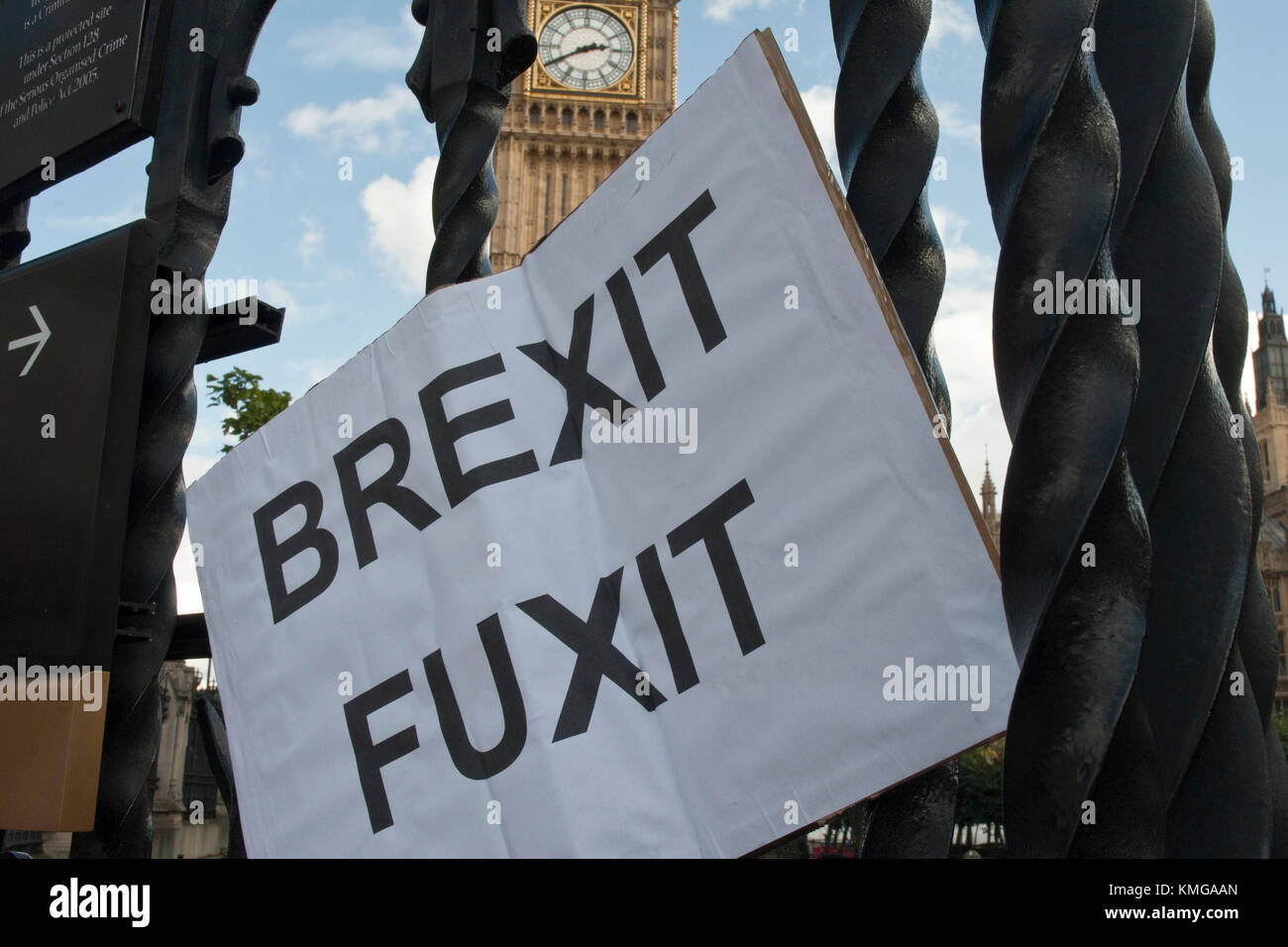 Placard stuck in the railings in front of Big Ben saying "Brexit Fuxit ...
