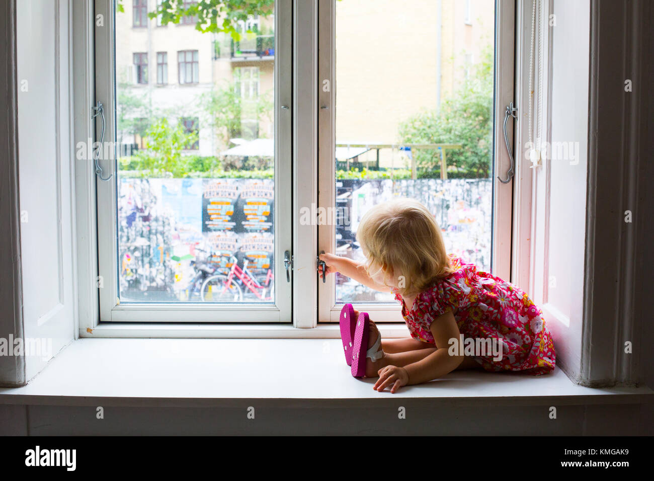 Girl and the window Stock Photo - Alamy