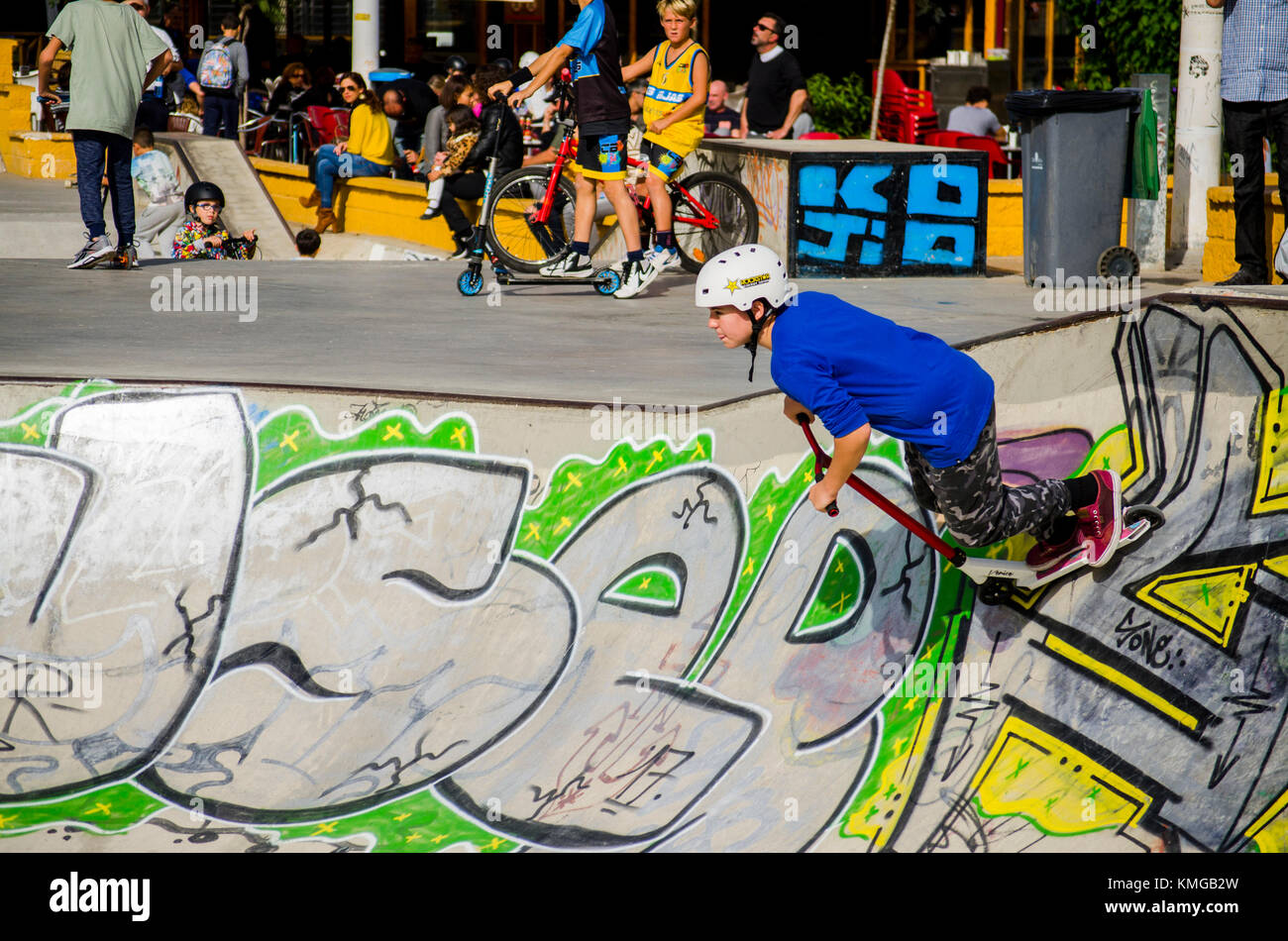Box stunt scooters, riders at skate park, during freestyle competition ...