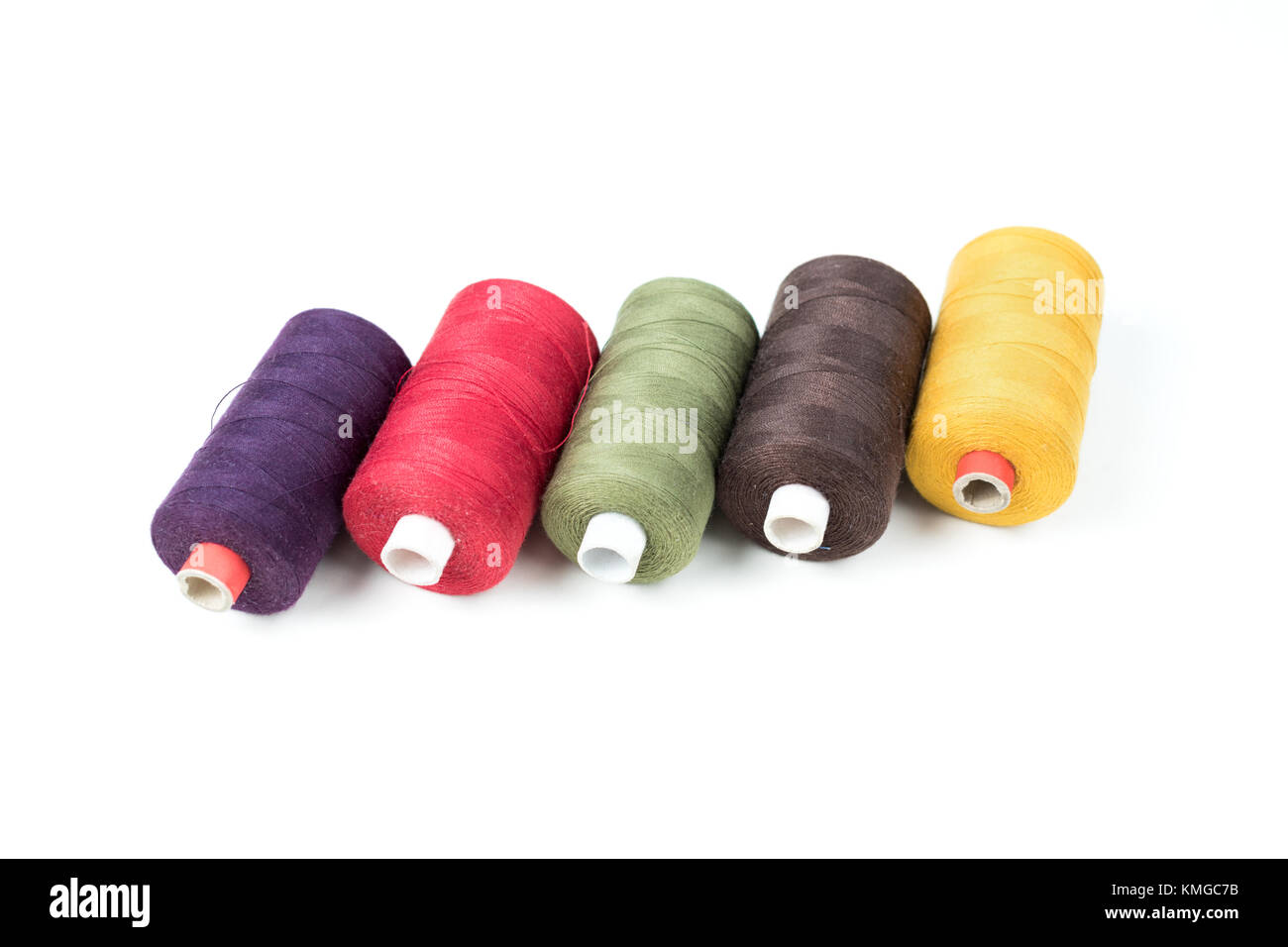 Colored thread coils on white background, sewing accessories Stock ...