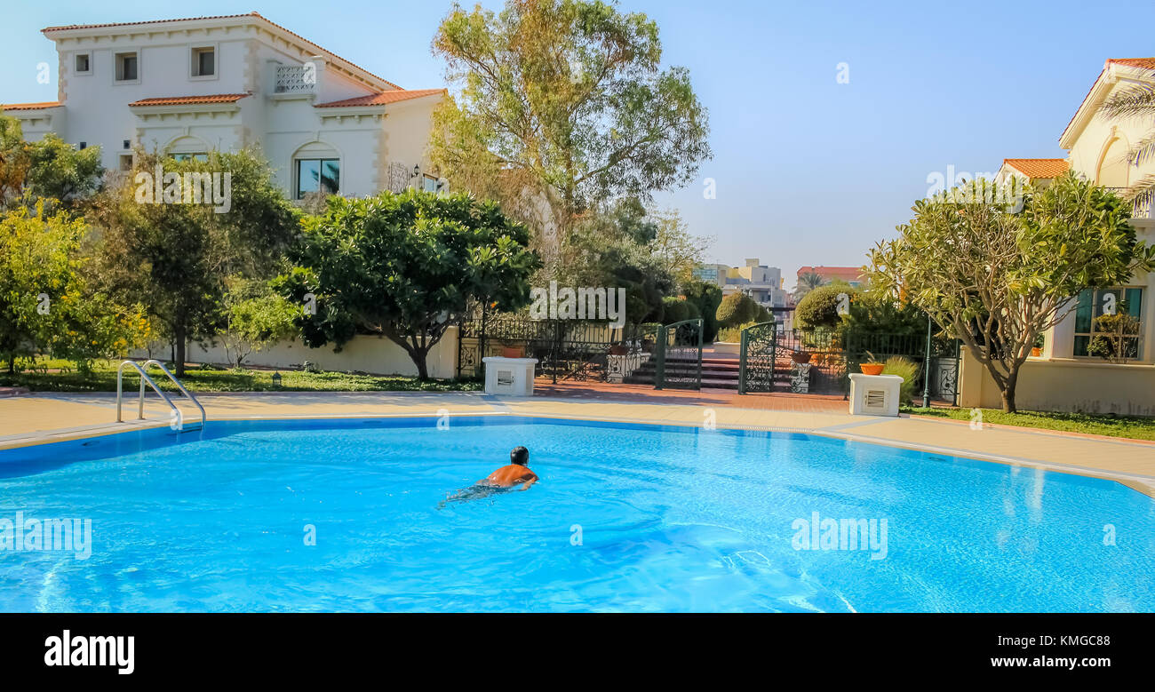 KUWAIT - SEPTEMBER 3, 2015 - Going for a swim in the pool on September ...