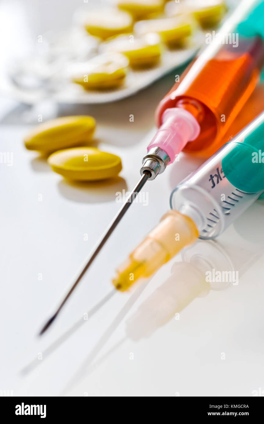 Different pills and syringe - health care Stock Photo - Alamy
