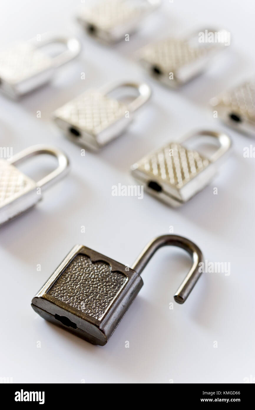 rows of padlocks on white background - open lock Stock Photo - Alamy