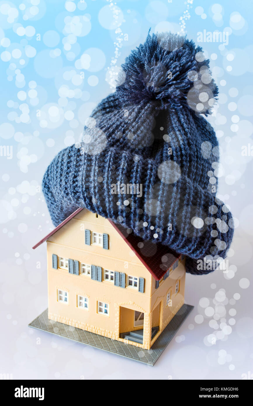 house in winter - heating system concept and cold snowy weather with ...