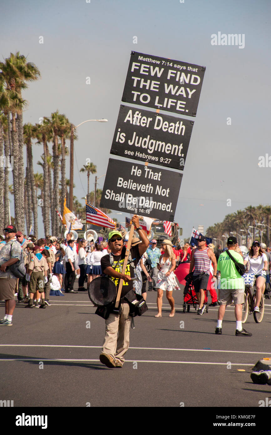 Equipped with a bull horn and carrying signs of Bible excerpts, a ...