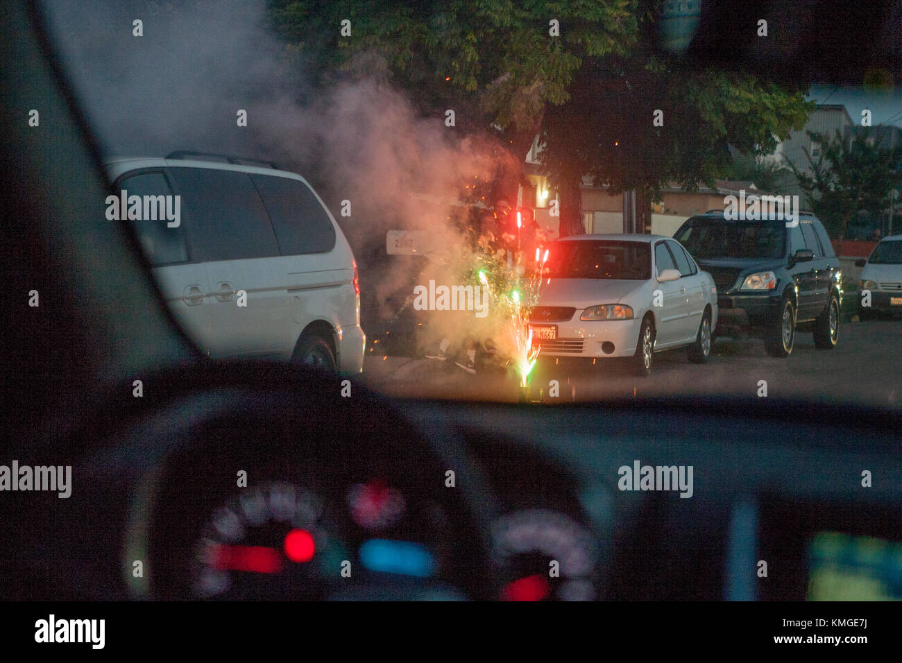 Legal "Safe and Sane" fireworks are seen from a police car celebrating ...