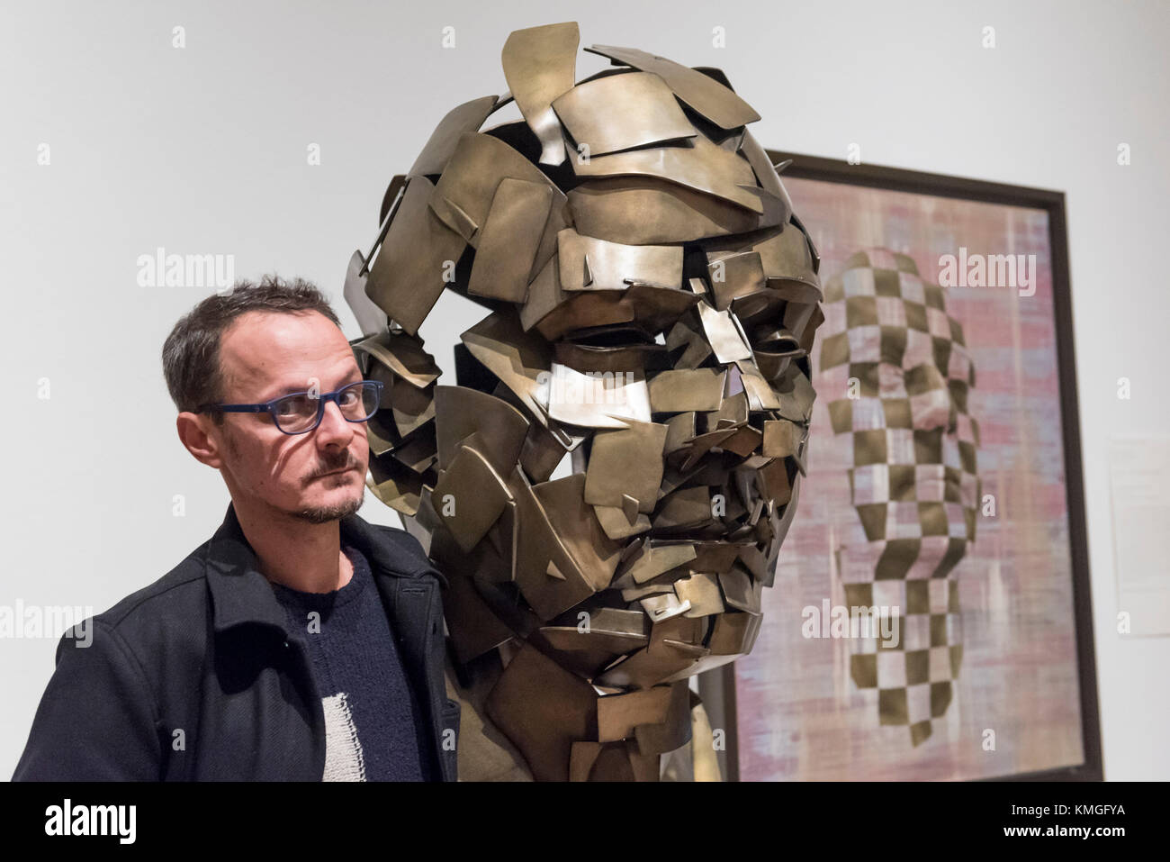 London, UK. 7 December 2017. Artist Jonathan Yeo stands with his work ...