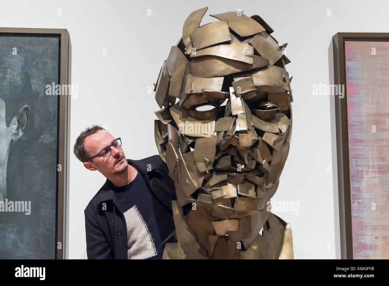 London, UK. 7 December 2017. Artist Jonathan Yeo stands with his work ...